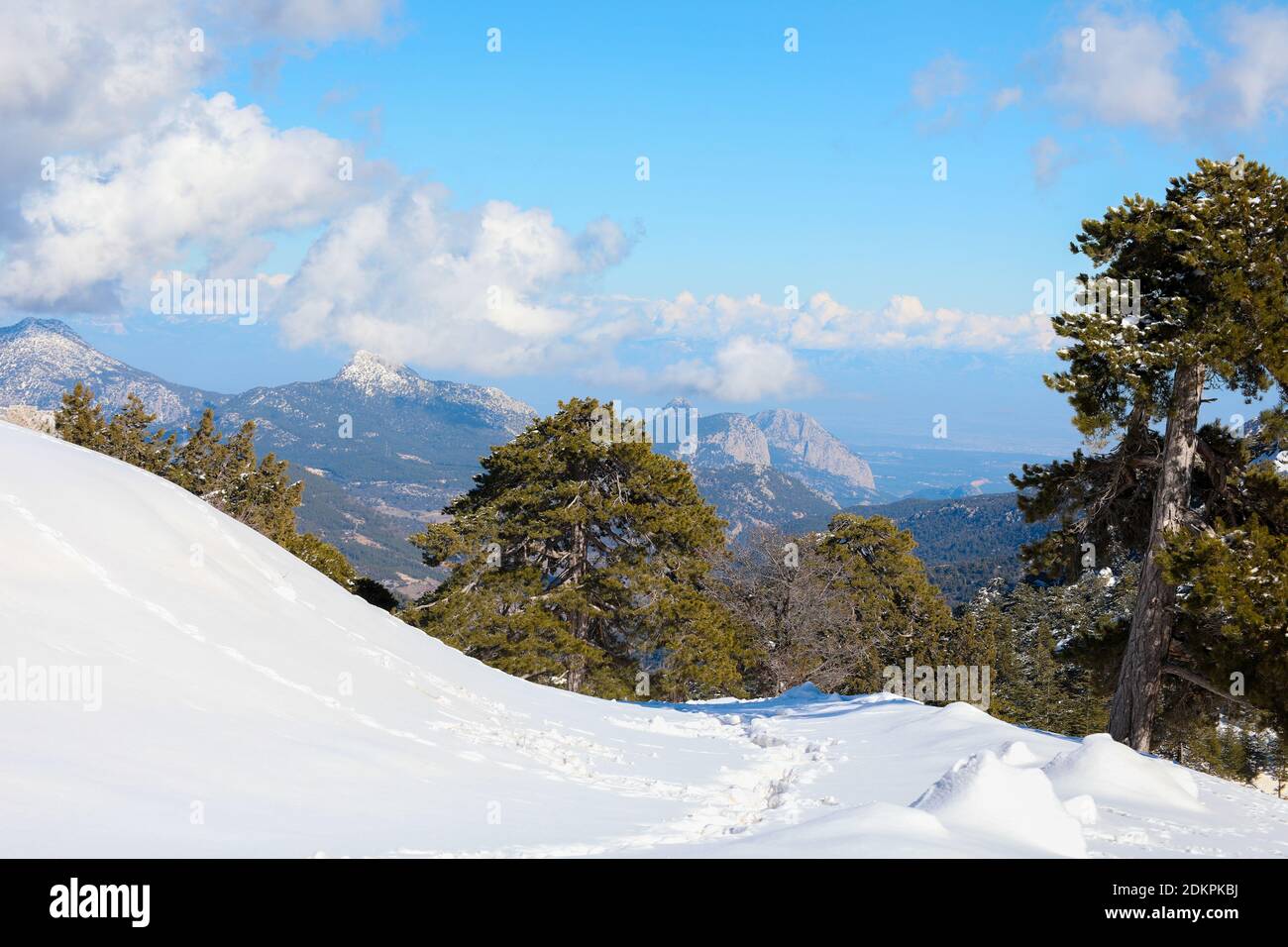 Winter Mountains landscape with snow covered peaks Against blue Sky in ...