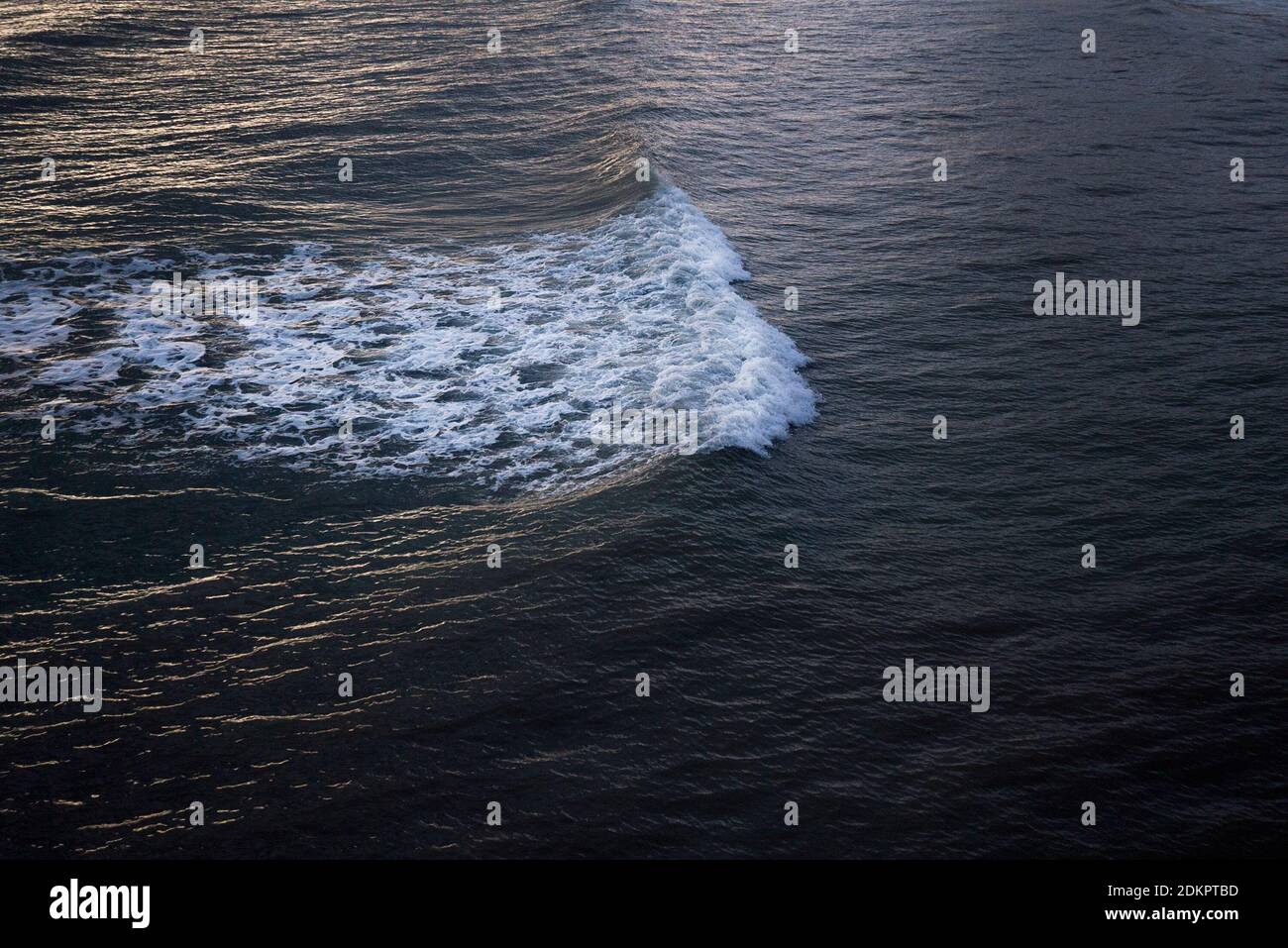 A Sidelong Shot Of A Wave Building In The Sea Off Brighton, East Sussex ...