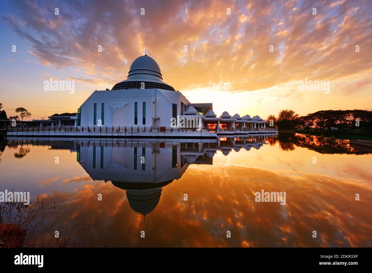 Reflections Of Mosque During Sunrise Stock Photo - Alamy