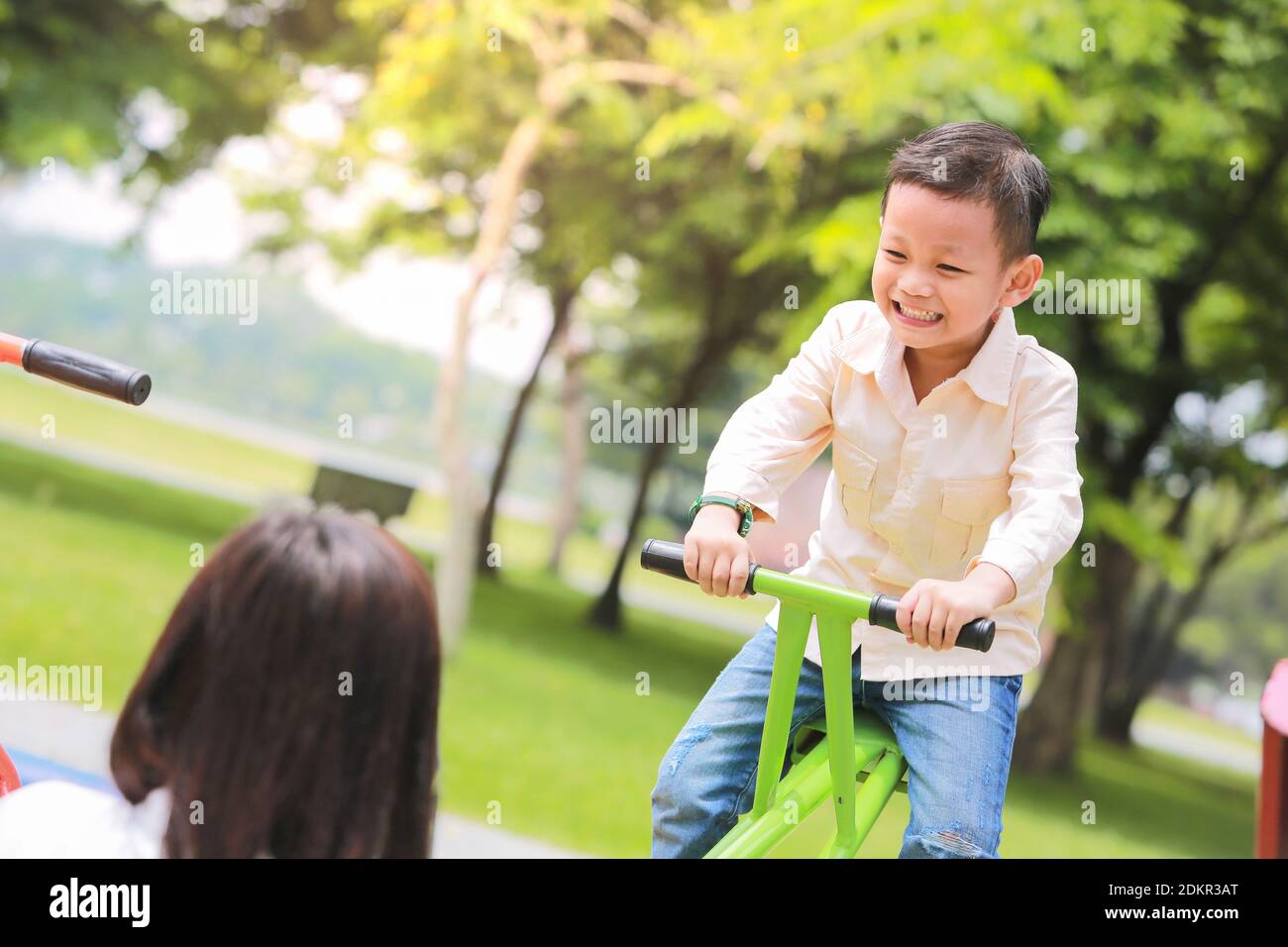 Family sitting on seesaw hi-res stock photography and images - Alamy