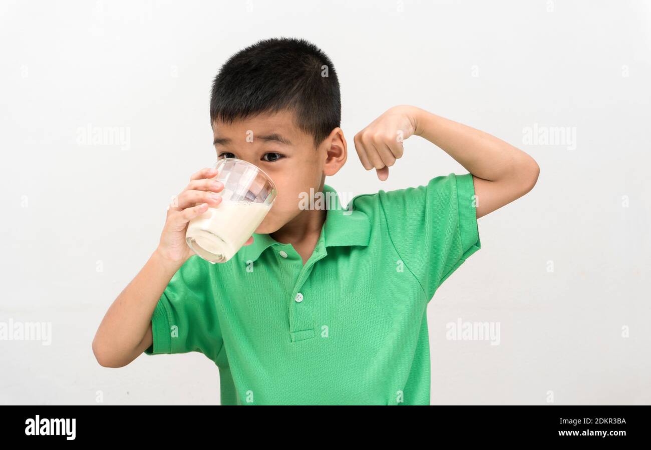 Boy Drinking Milk While Against White Background Stock Photo - Alamy
