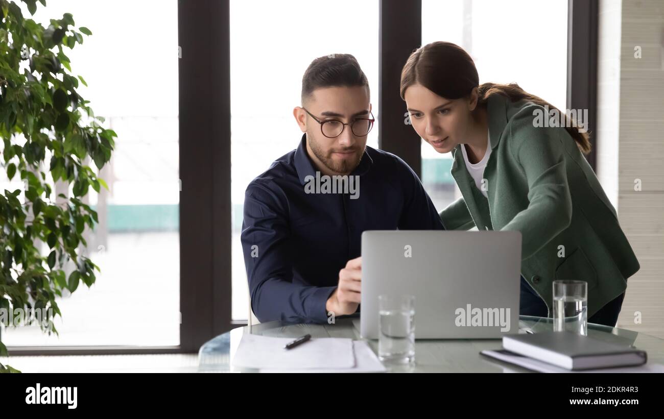 Diverse colleagues collaborate in hi-res stock photography and images ...