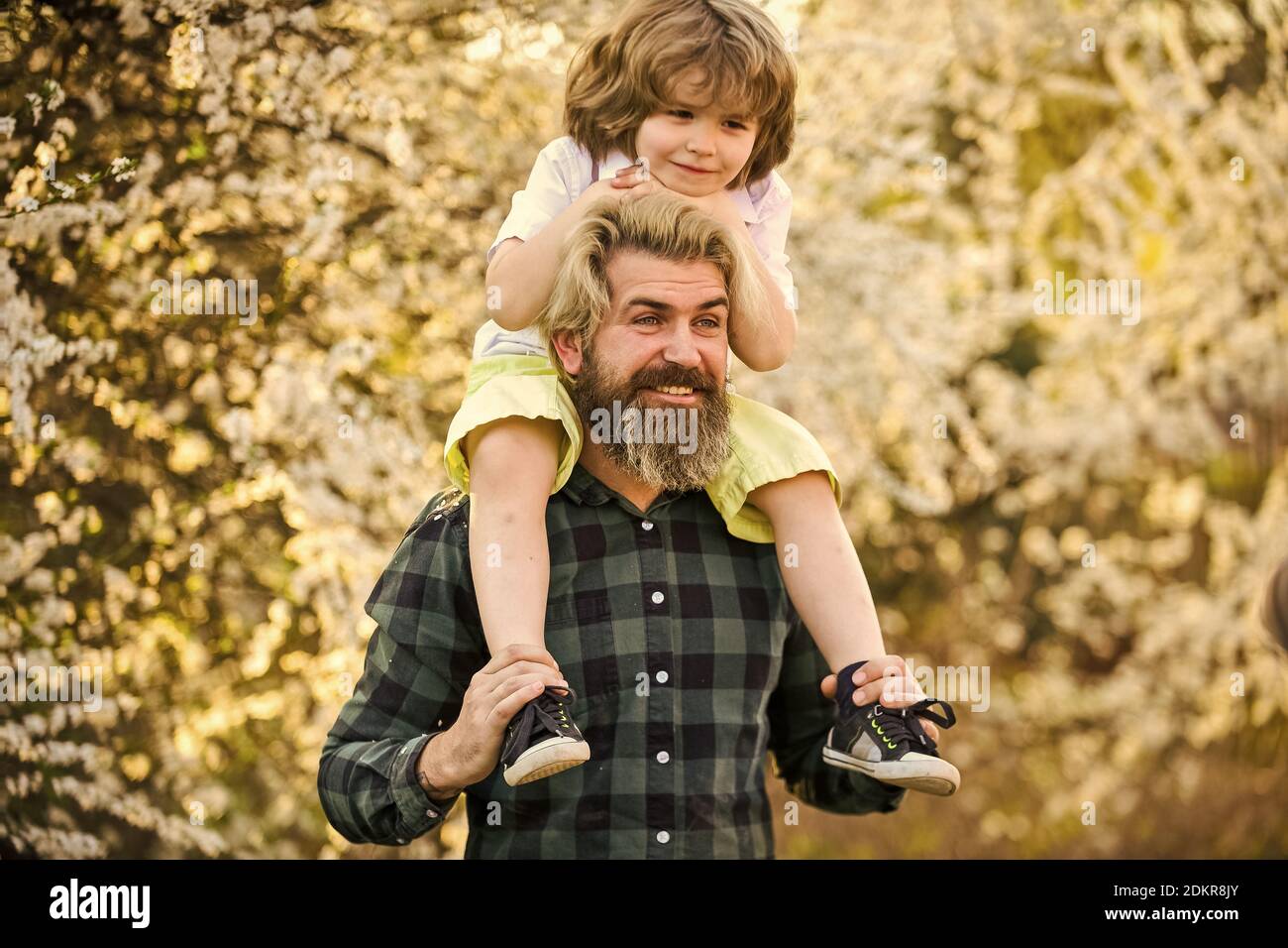 Earth day. Little boy and father in nature background. Hipster and baby ...