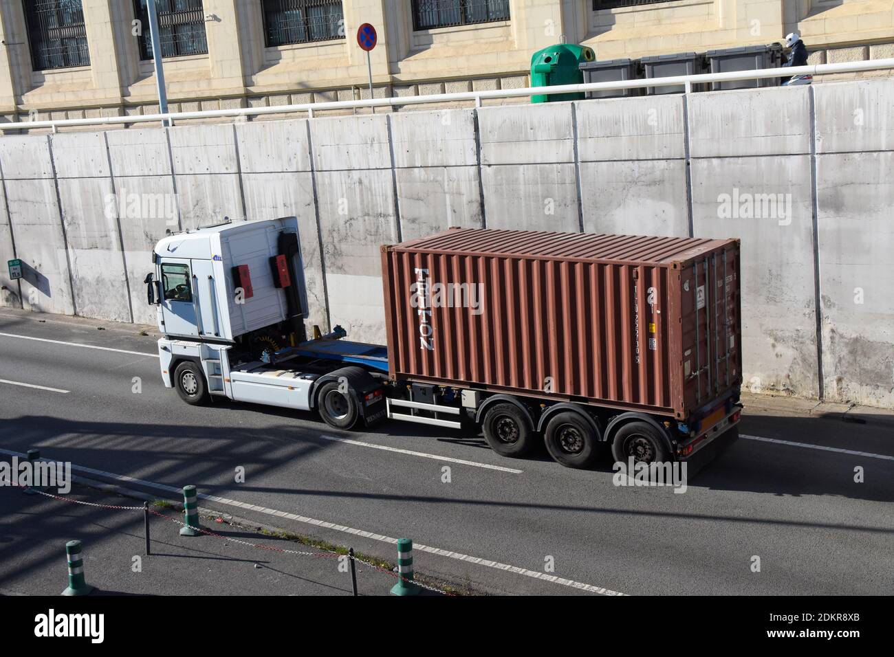 White truck with Triton container on dual carriageway Stock Photo - Alamy