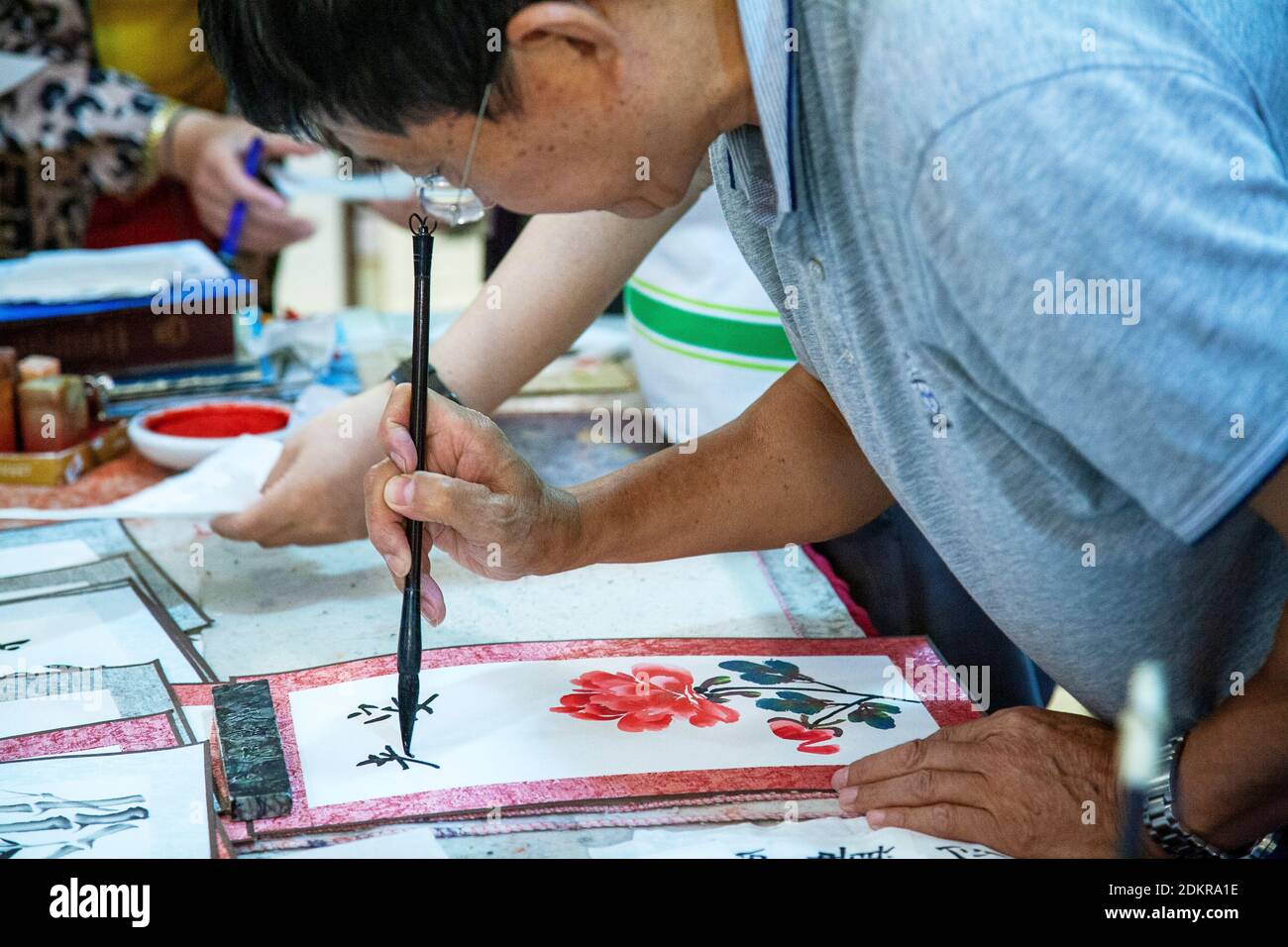 Chinese Caligraphy master writing with brush within Wild Goose Pagoda ...