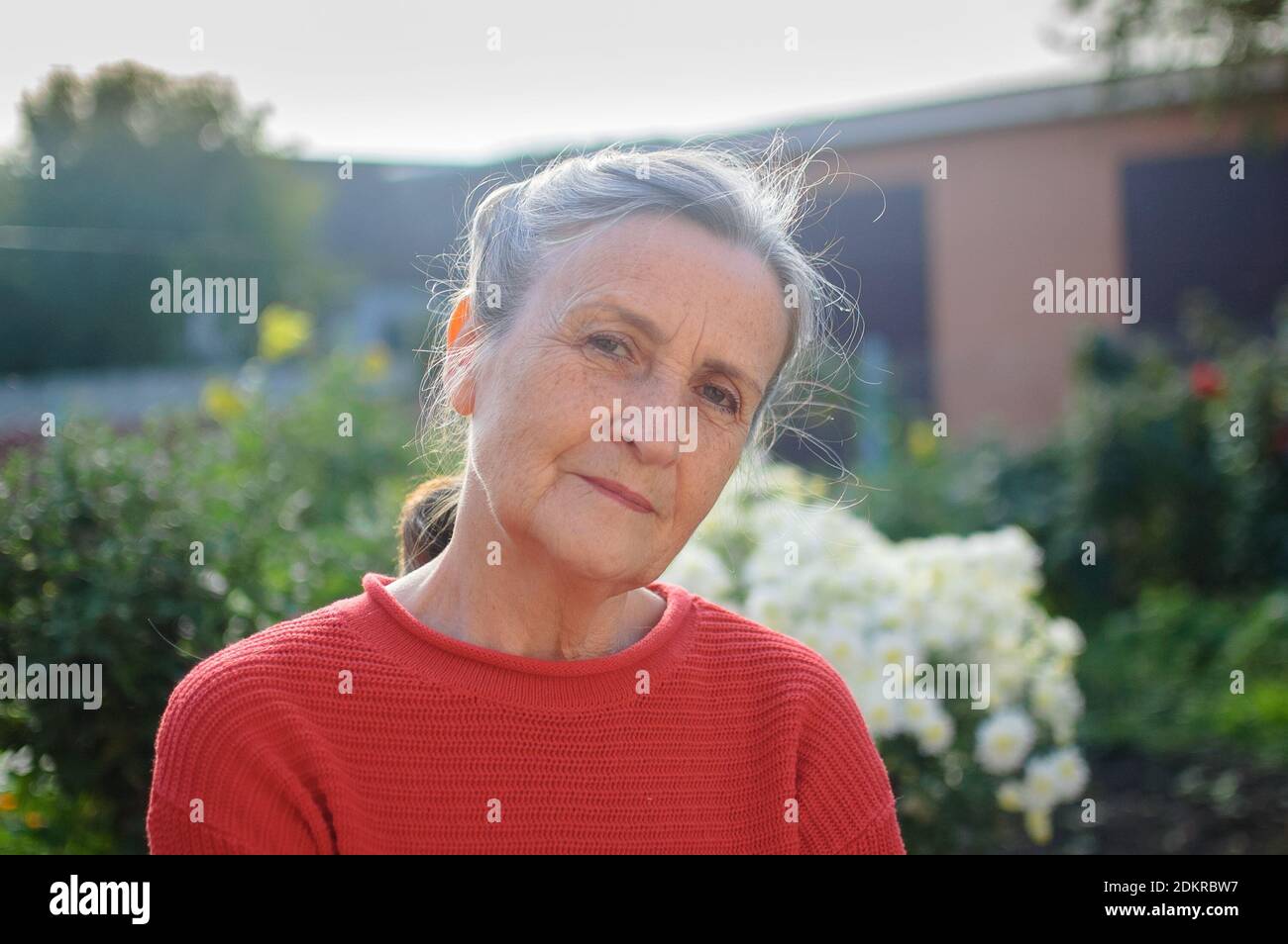 Beautiful old grandmother with grey hair and face with wrinkles ...