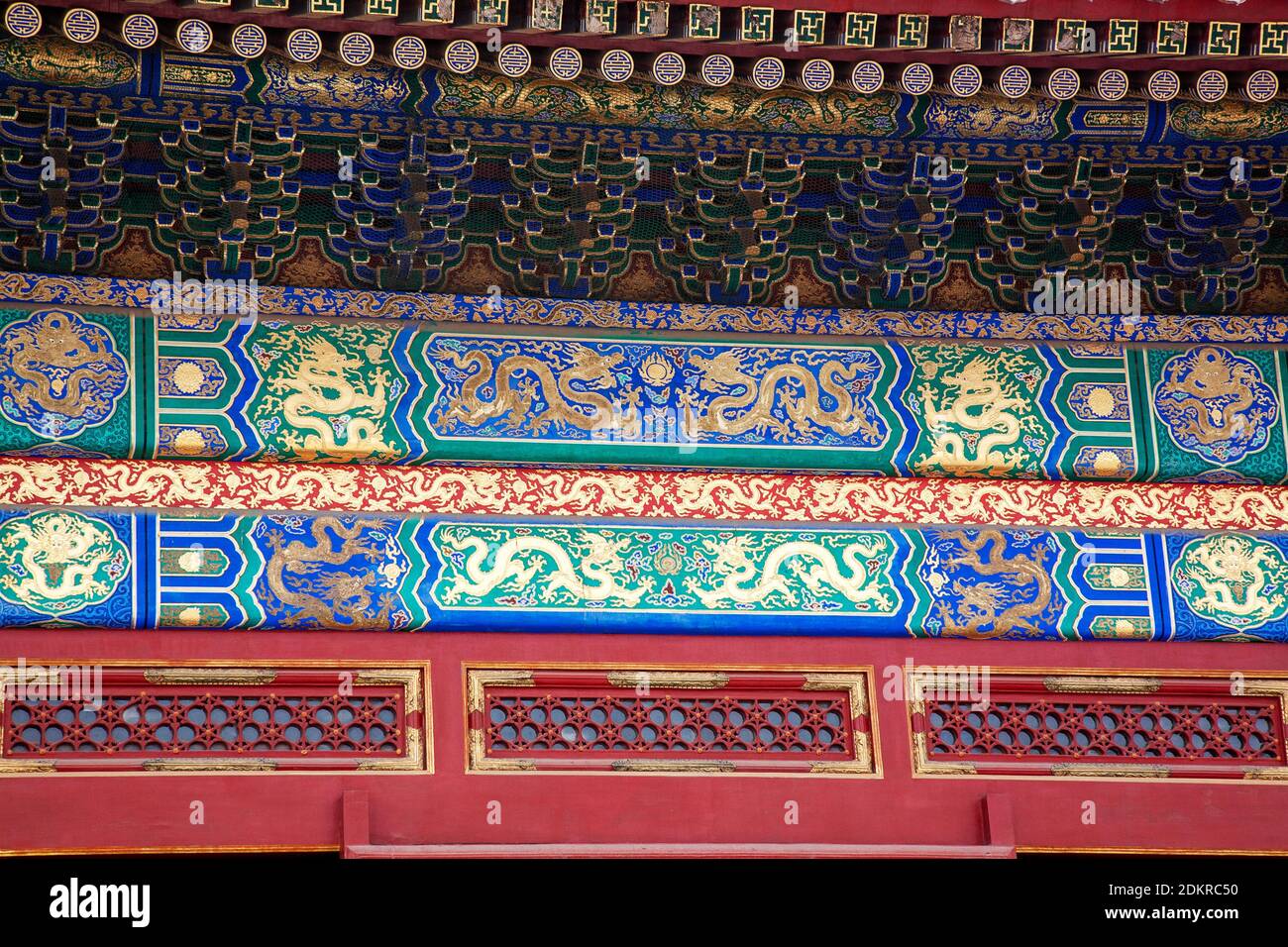 Ornate fretwork and art on wall of building in Forbidden Imperial City ...