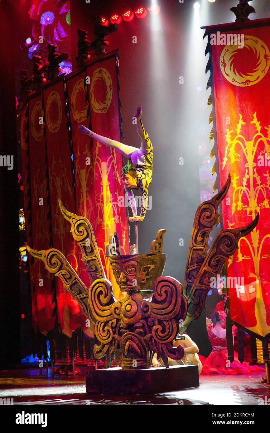 Female Chinese acrobat balances at Chaoyang Theater Beijing China Stock ...