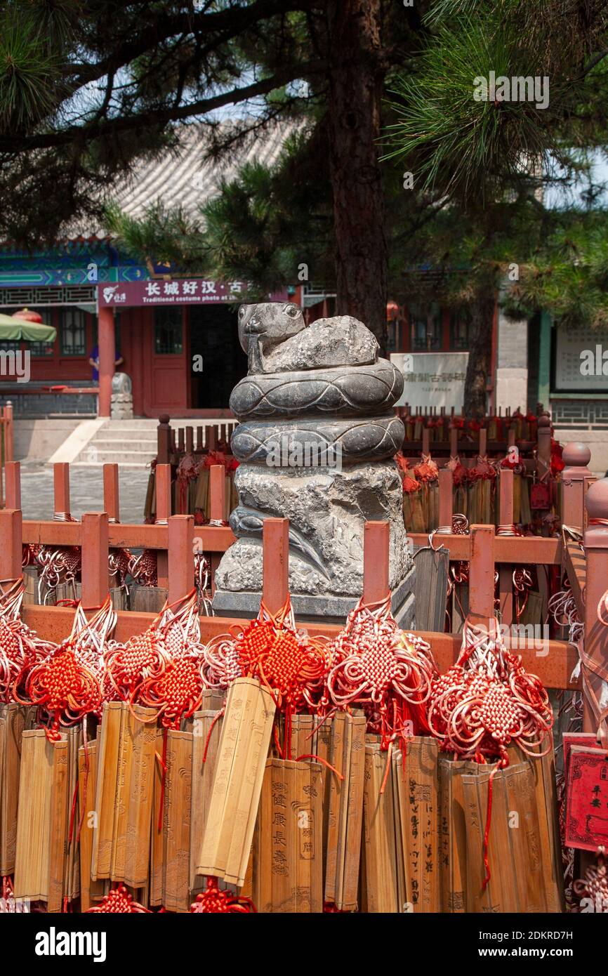 Red Chinese prayer sticks with statue for Year of the Snake near Great ...