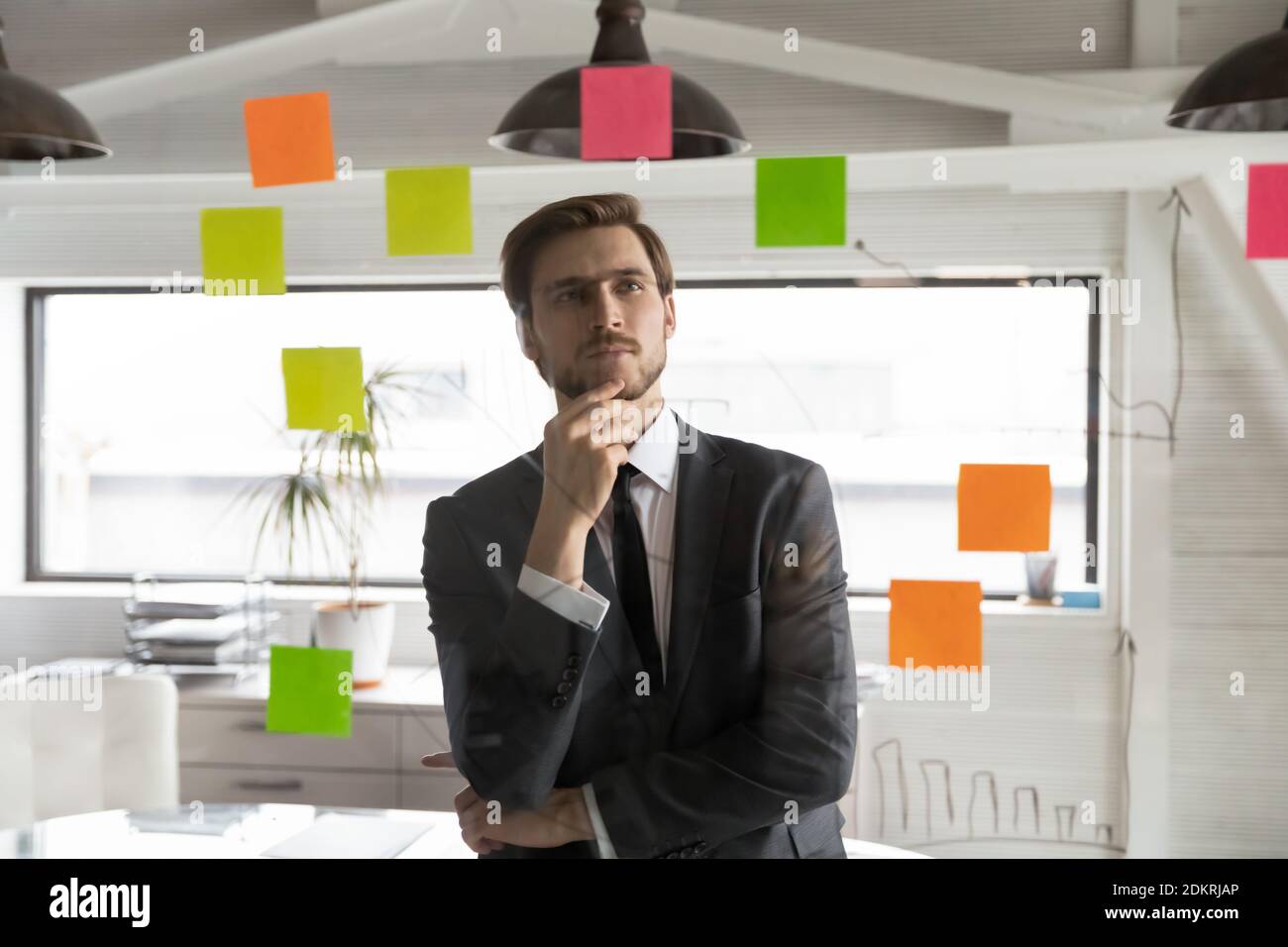 Pensive young businessman do creative thinking in office Stock Photo ...