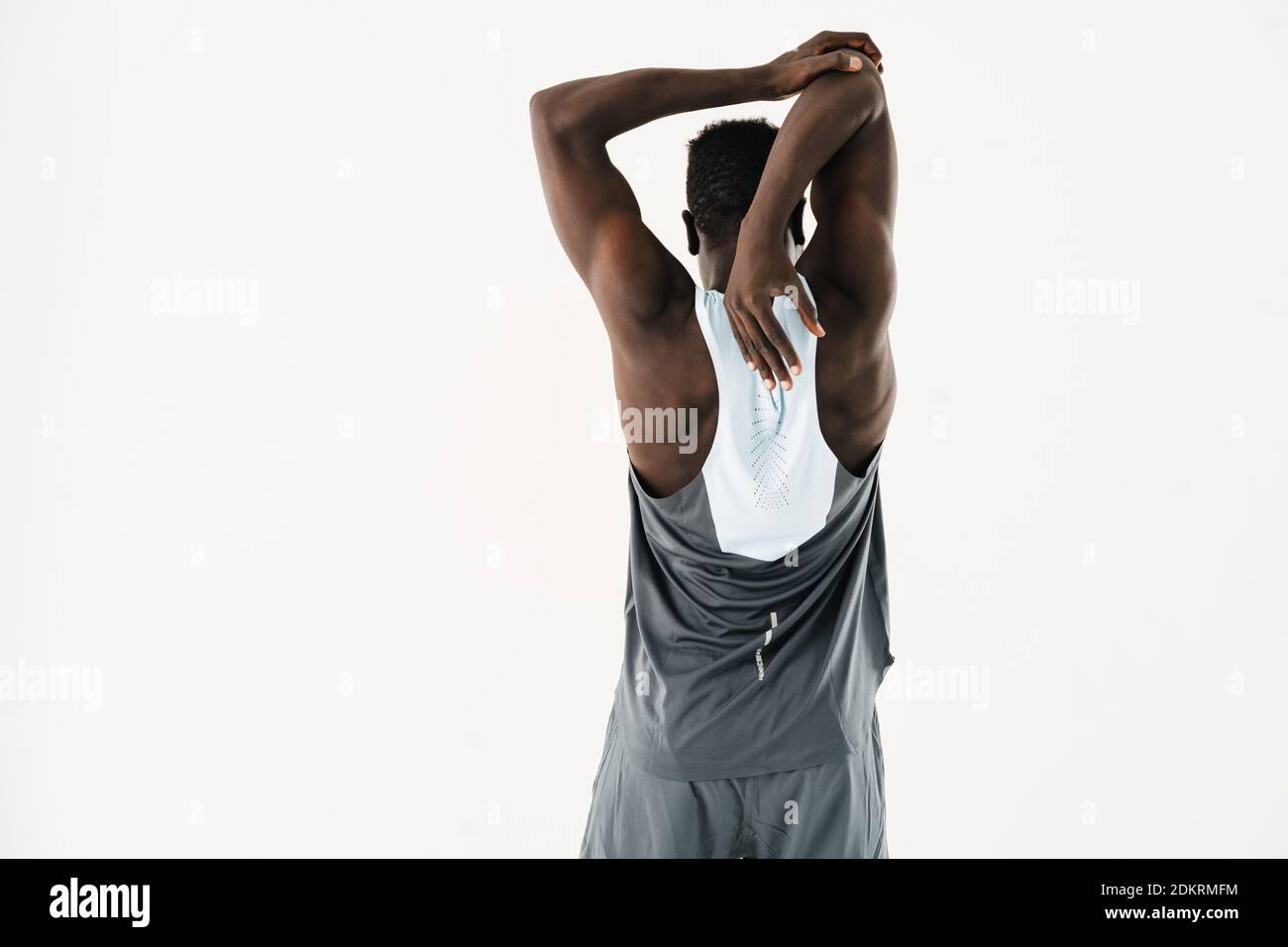 Young african american sportsman doing exercise while working out ...