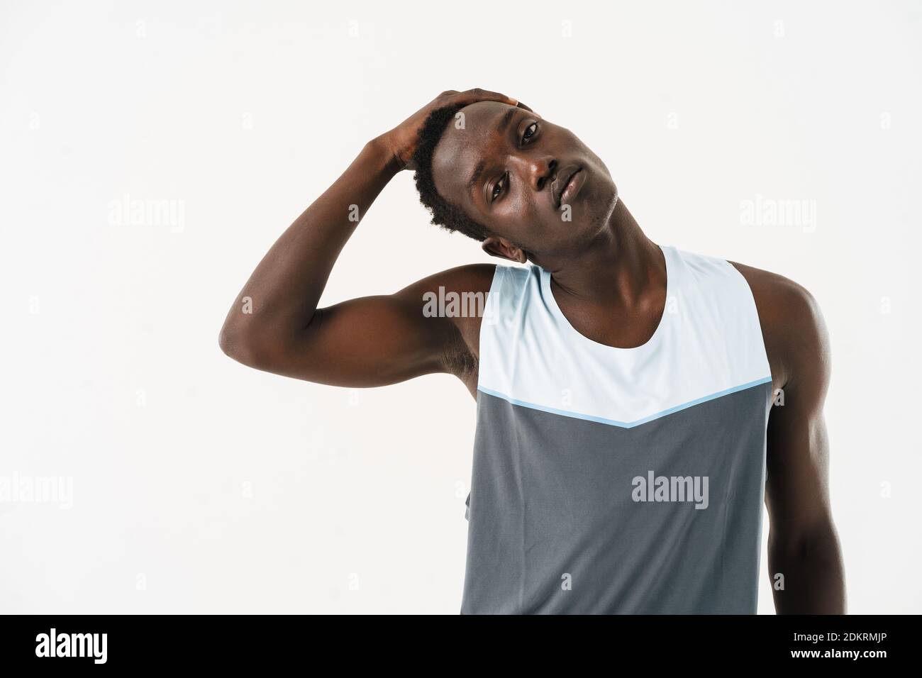 Young african american sportsman stretching his neck while working out ...
