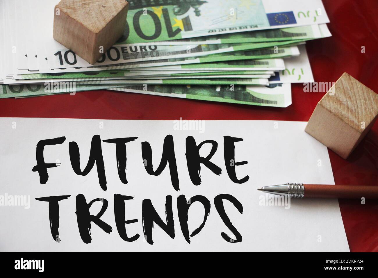 Future trens words on a page, 100 euro banknotes and luxury pen ...