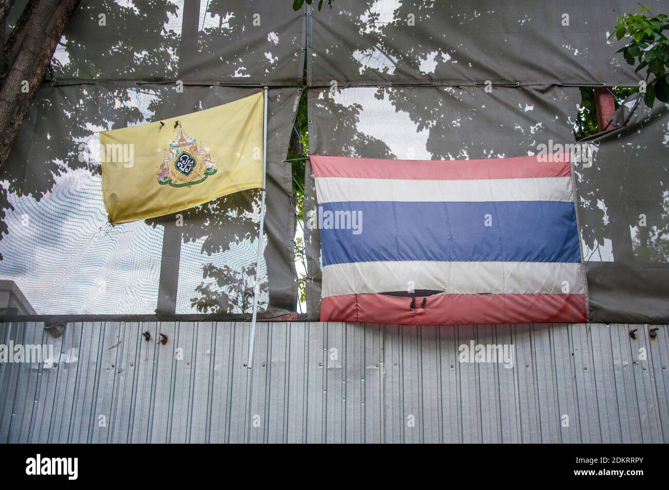 A Thailand National flag and The Royal flag of King Rama X are seen on ...