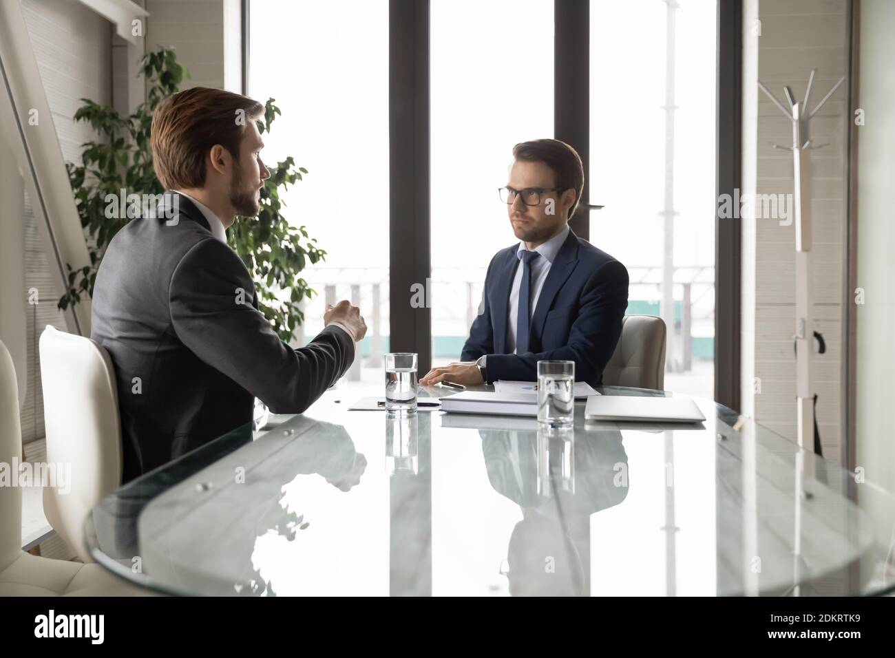Serious businessmen discuss business ideas at office meeting Stock ...
