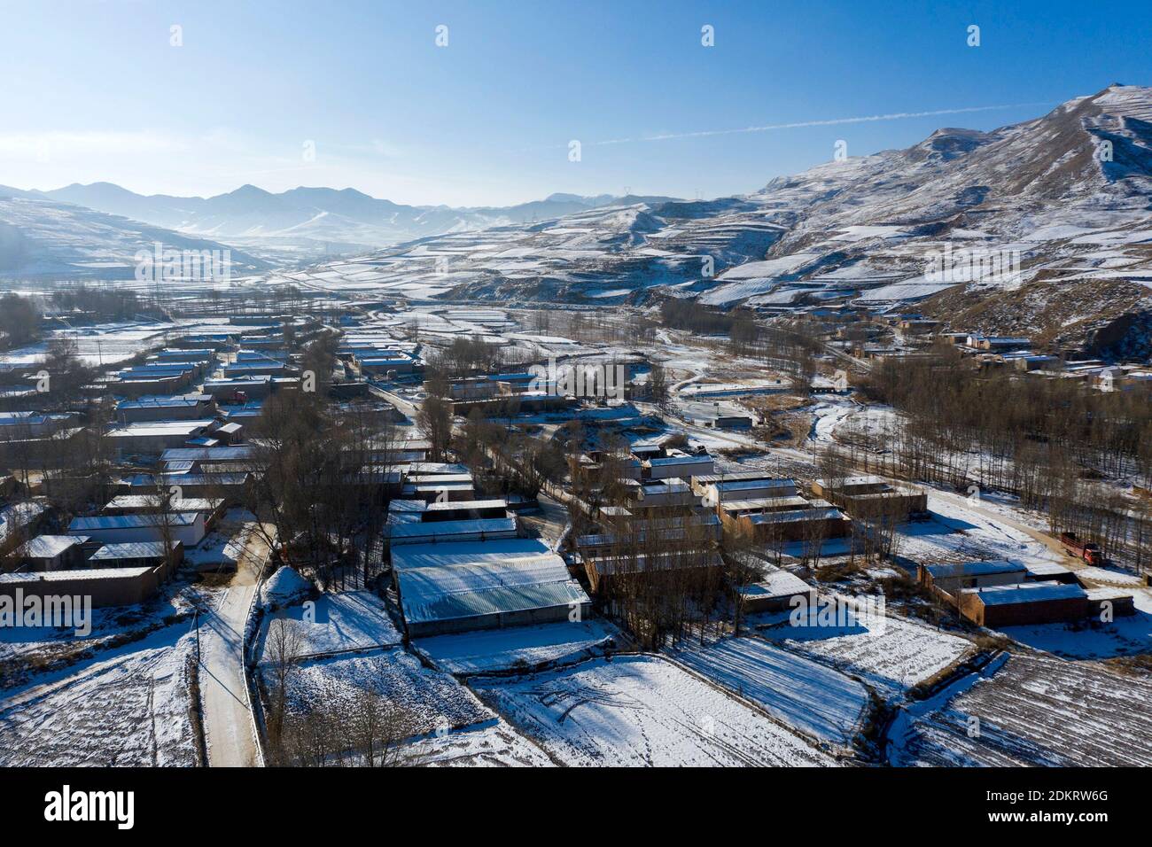 The snow scenery of the Qilian Mountains is pictured in Shigou village ...