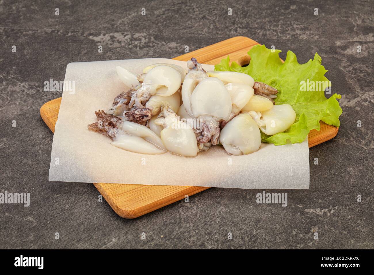 Raw seafood - cuttlefish for cooking over board Stock Photo - Alamy