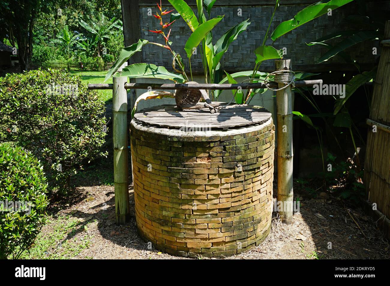 Northern Thai Lanna water spring well by the traditional house Stock ...