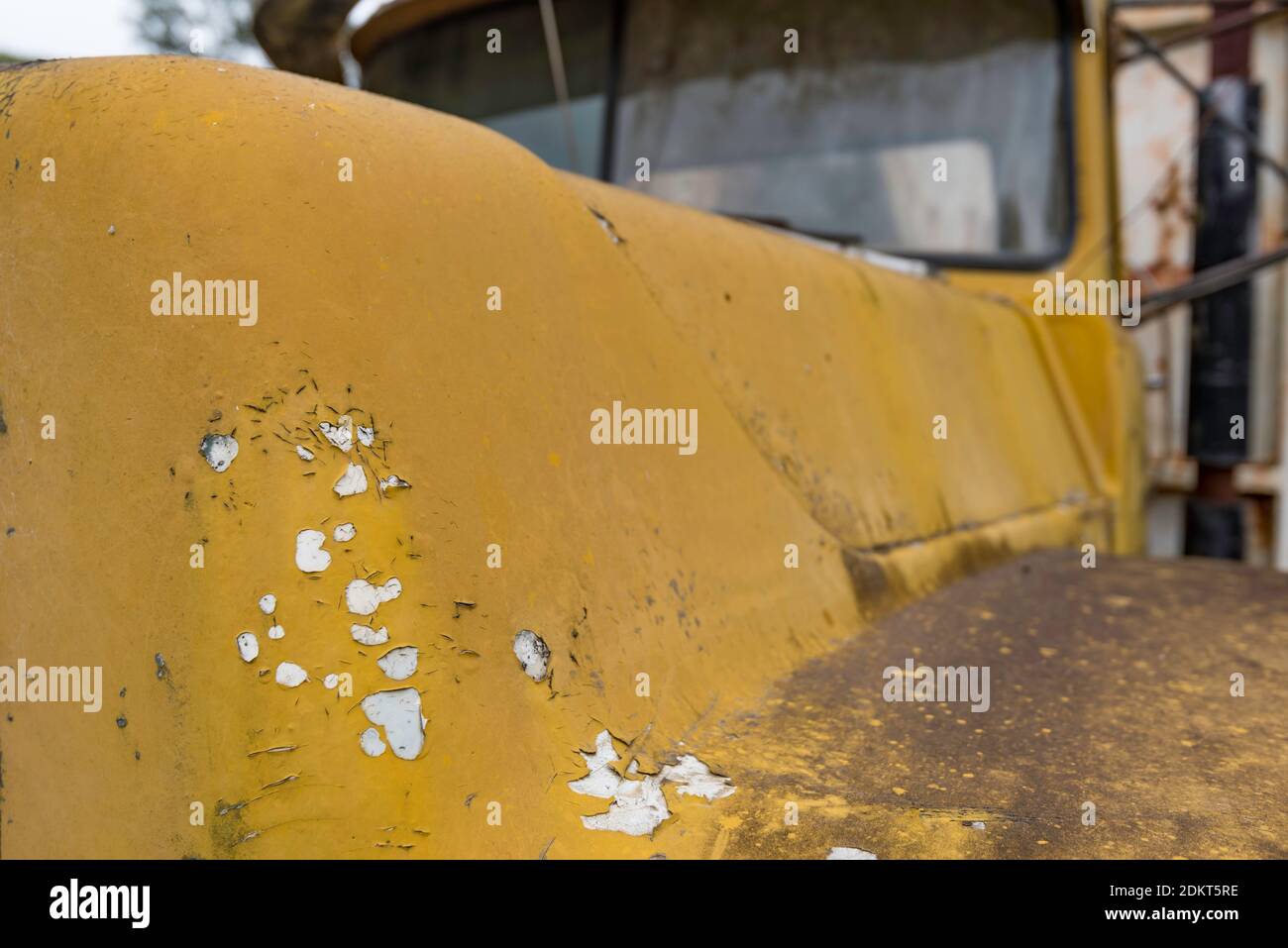 A close up of a 1970's model orange Mack R model truck hood and cab ...