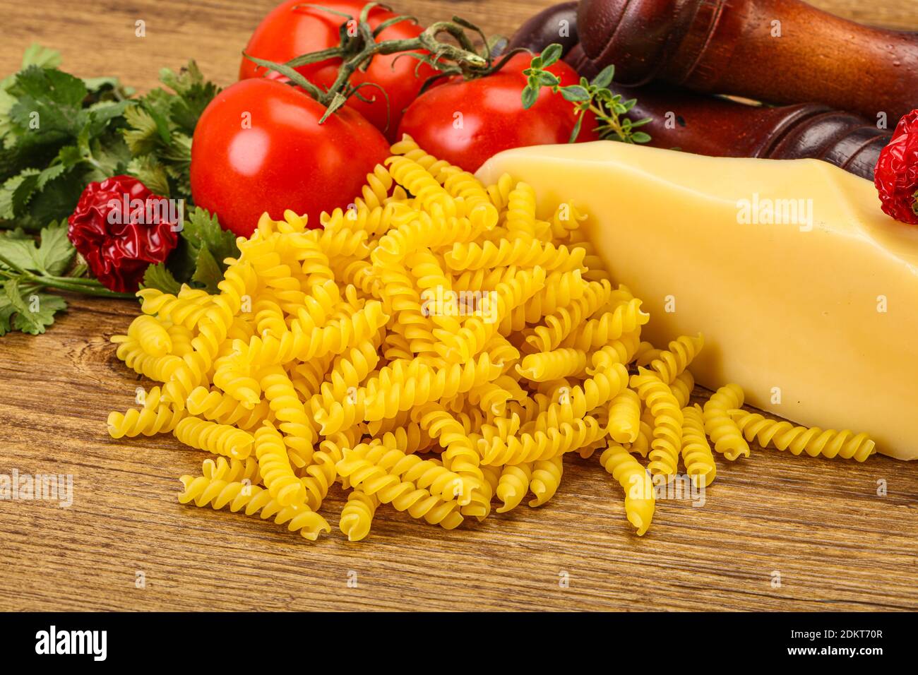 Raw Italian pasta Fusilli for cooking with vegetables Stock Photo - Alamy