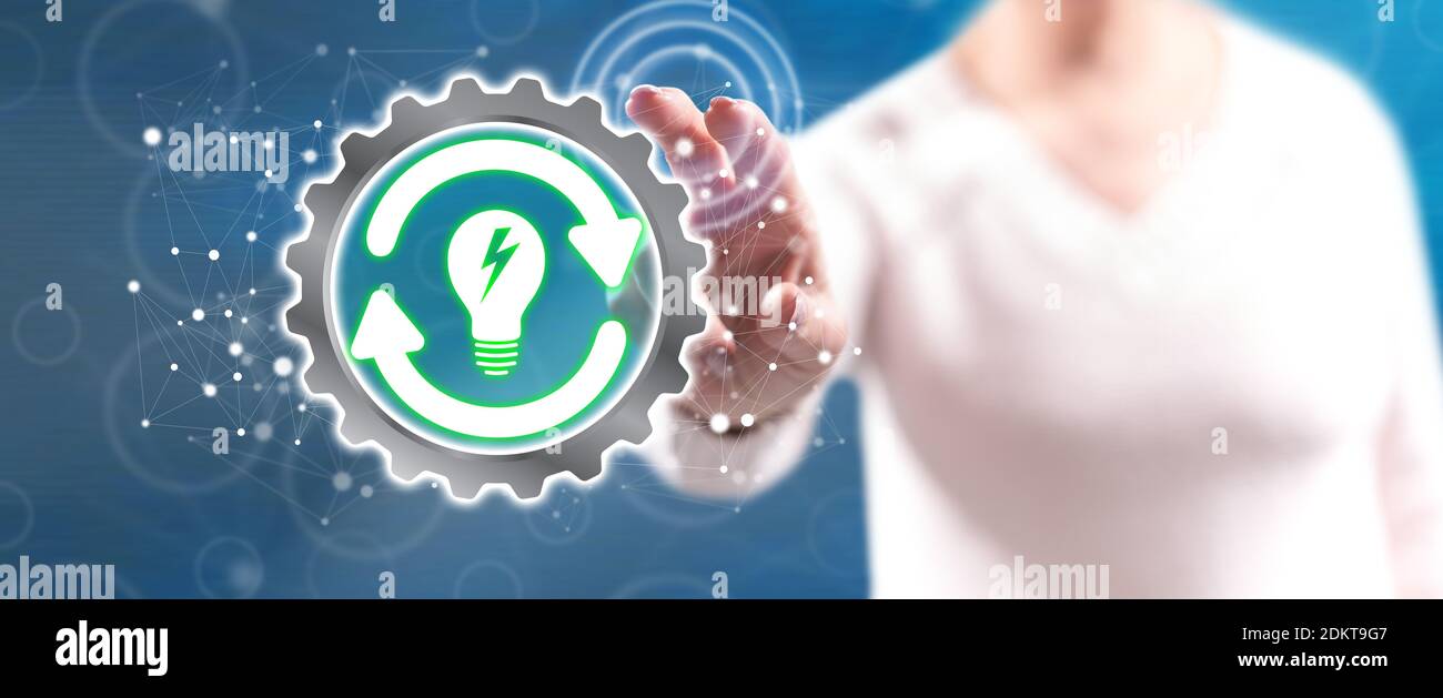 Woman touching a renewable energy concept on a touch screen with her ...