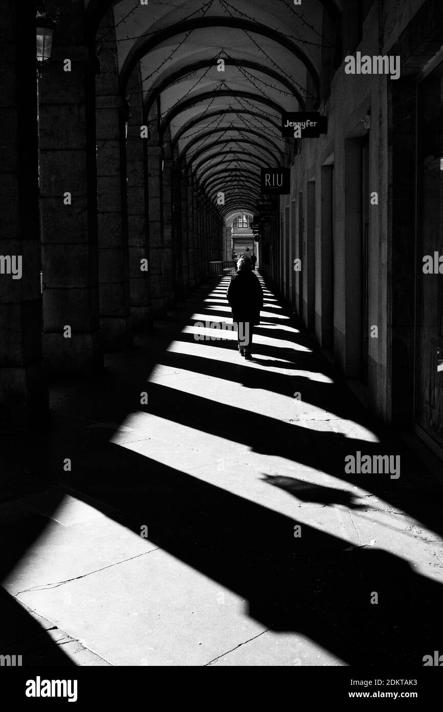 Walking under the arch Black and White Stock Photos & Images - Alamy
