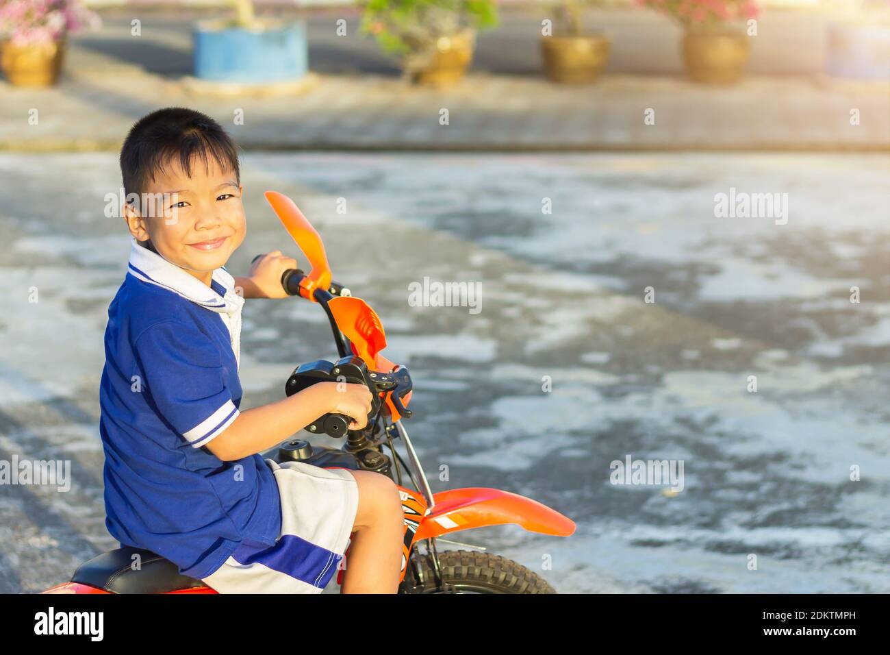 Boy on motorcycle hi-res stock photography and images - Alamy