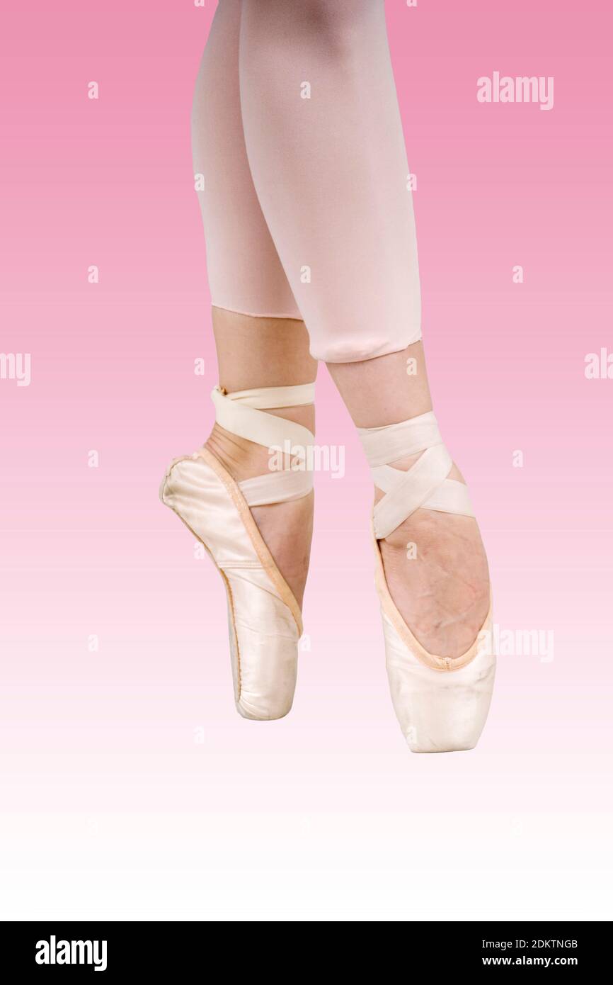 Female Ballet Dancer balances on her toes Stock Photo - Alamy
