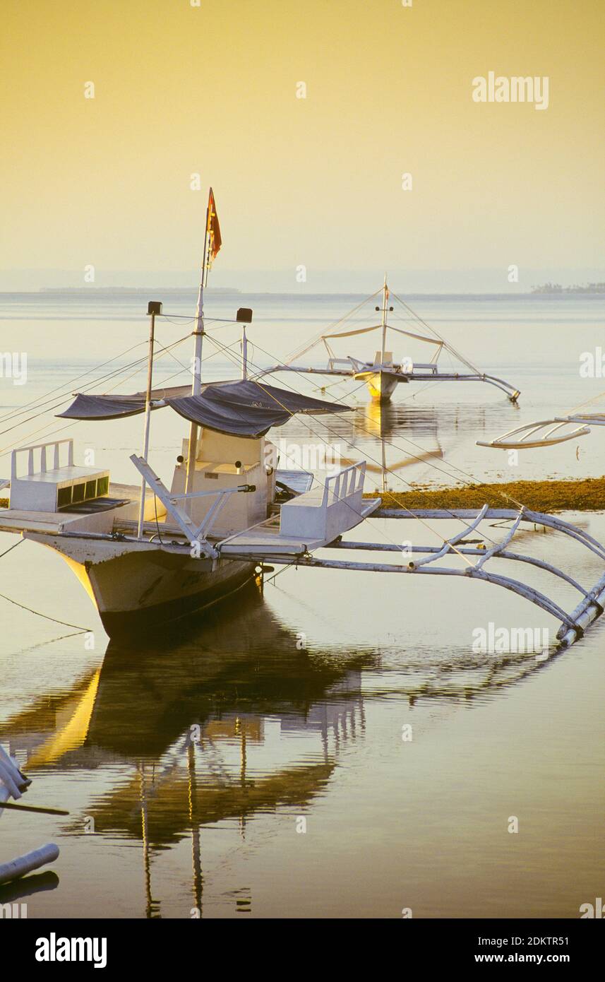 Traditional Filipino outrigger fishing boats, known as 'bangka' boats ...