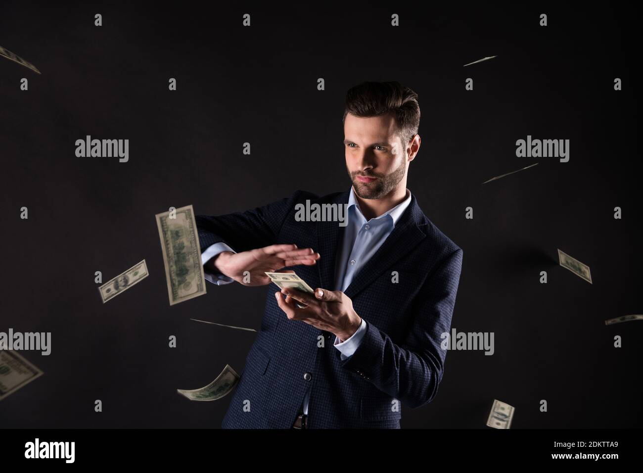 Photo of handsome business guy hold hands usa bucks rich successful ...