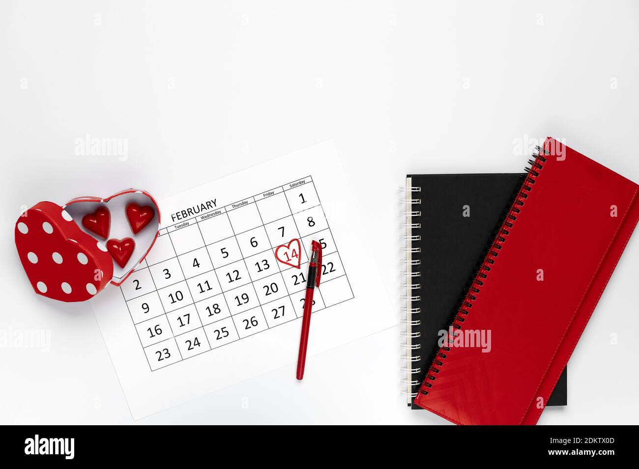 February of 14th calendar template with candy heart shape and notebooks ...