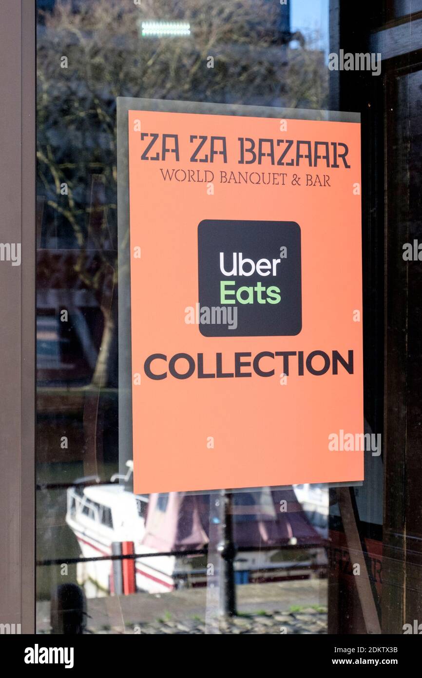 The Uber Eats collection sign on Za Za bazaar on Bristol Harbourside Stock Photo - Alamy
