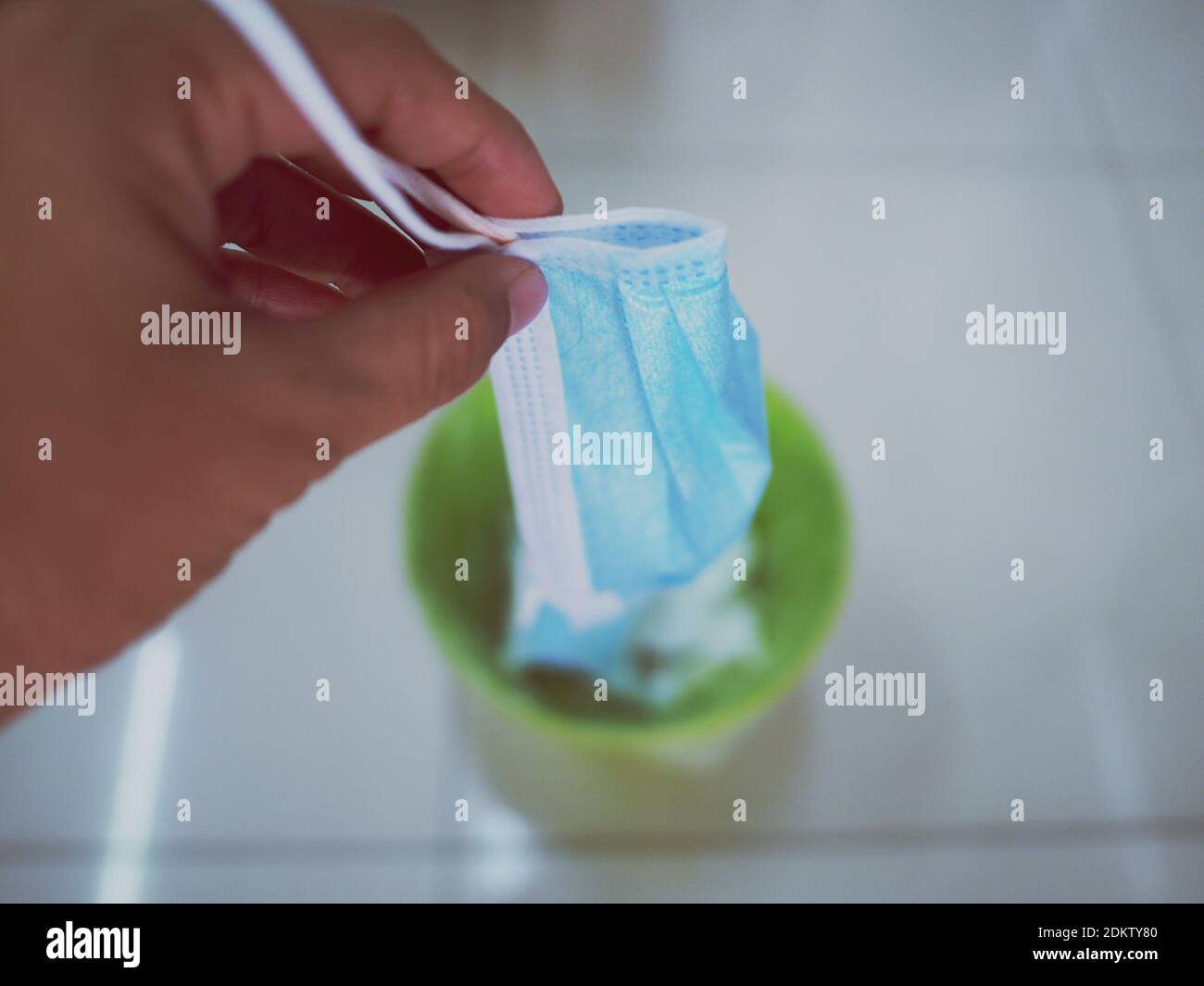 Putting face mask in bin hi-res stock photography and images - Alamy