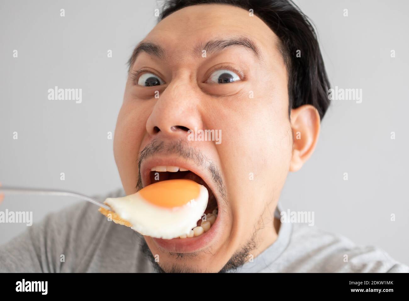 Man cooking egg and bacon hi-res stock photography and images - Alamy