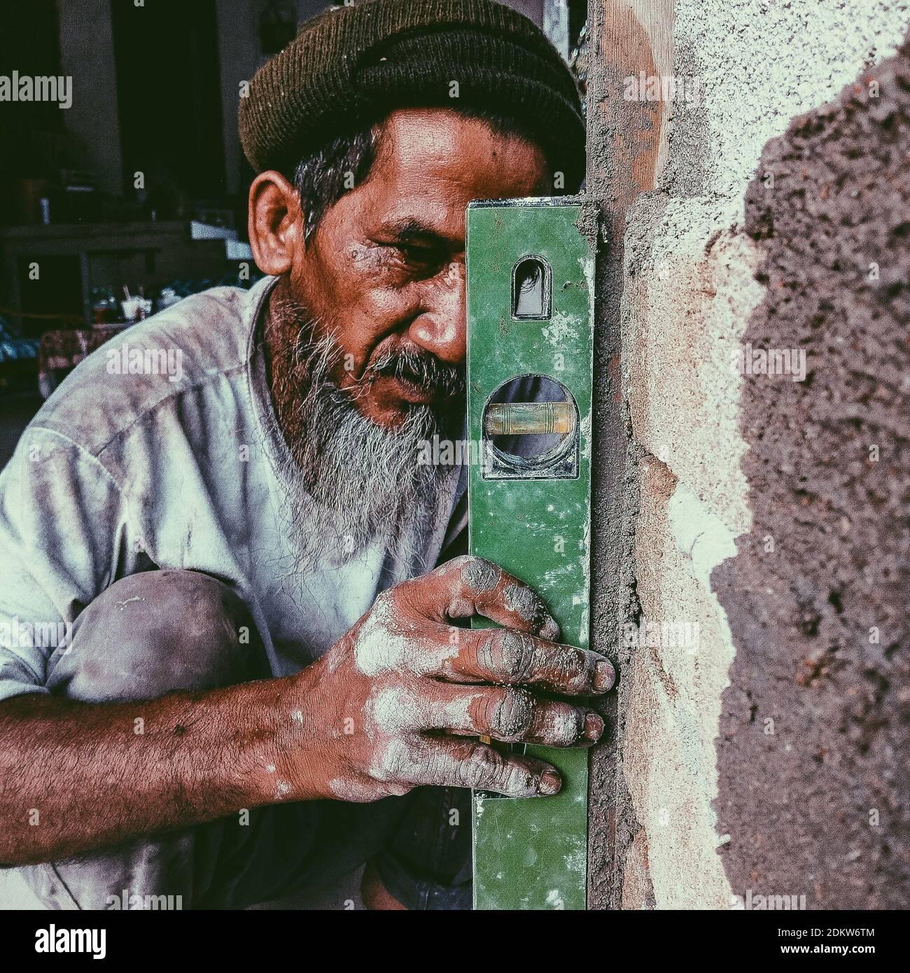 Indian man crouching on wall hi-res stock photography and images - Alamy