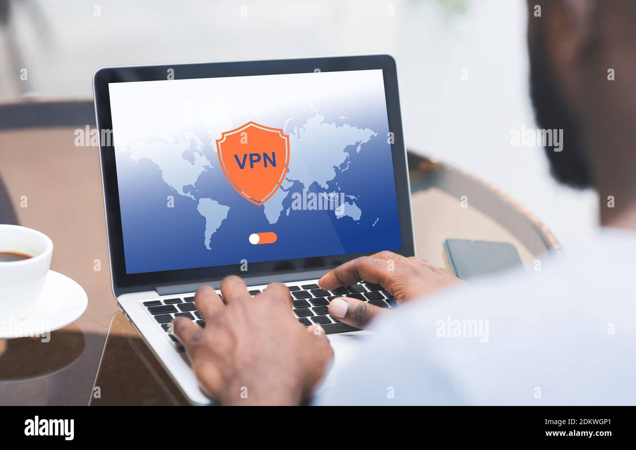 Black Man Using Laptop Computer With VPN Virtual Private Network ...