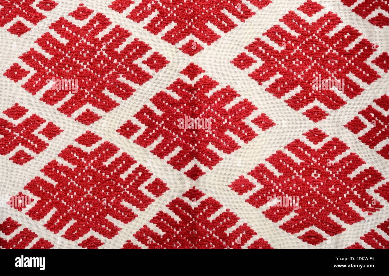 Homemade embroidered with red threads on canvas Stock Photo - Alamy