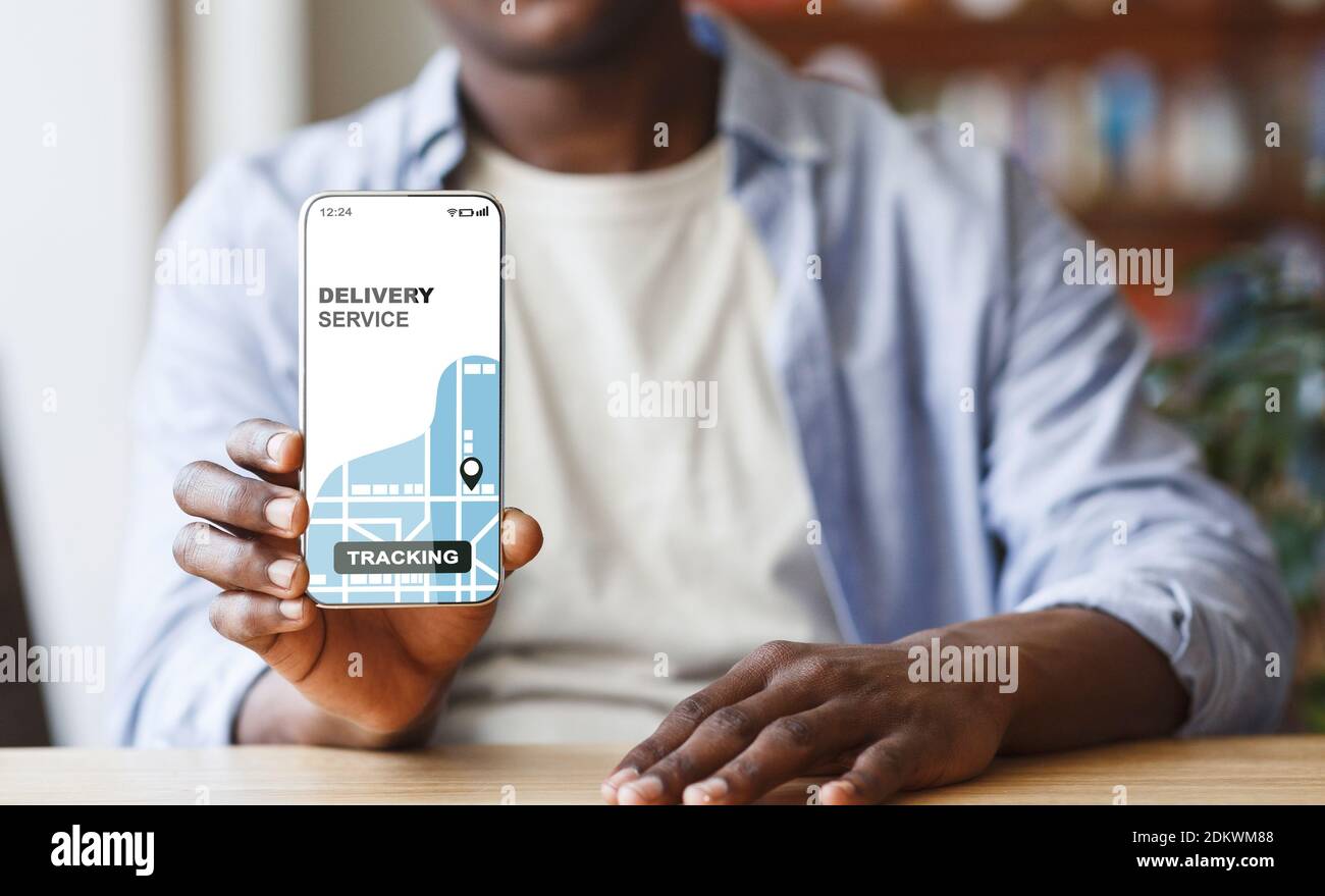 Black Man Demonstrating Smartphone With Opened Delivery Service ...