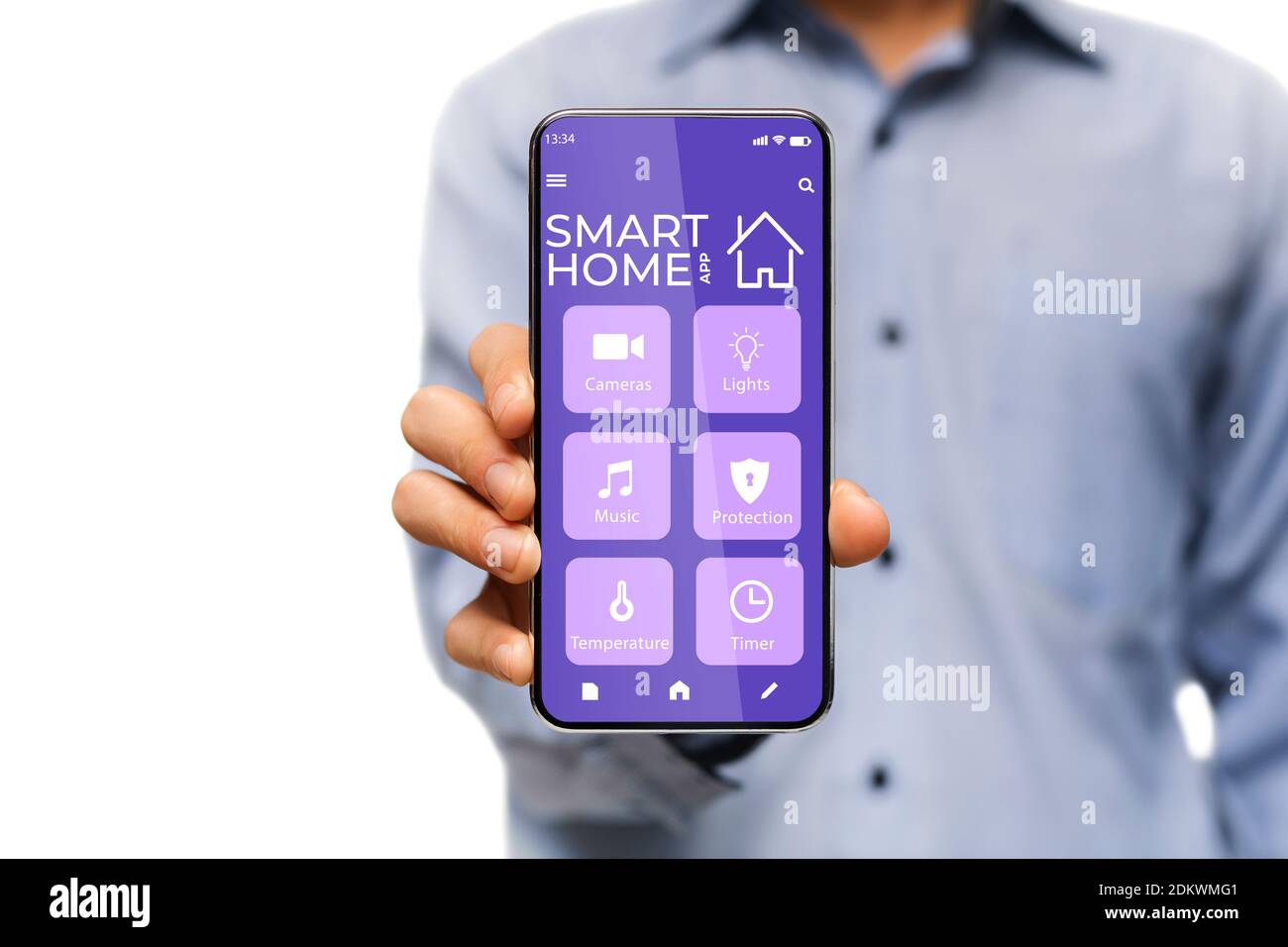 Unrecognizable young guy showing cellphone with smart home app digital ...