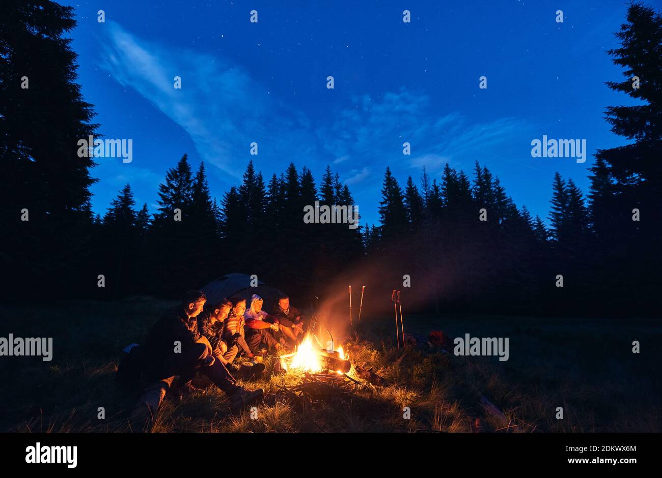 Summer night family campfire near tent hi-res stock photography and ...