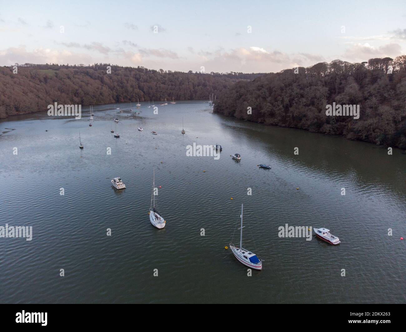 aerial drone of boats in the river near true cornwall uk and Malpas ...