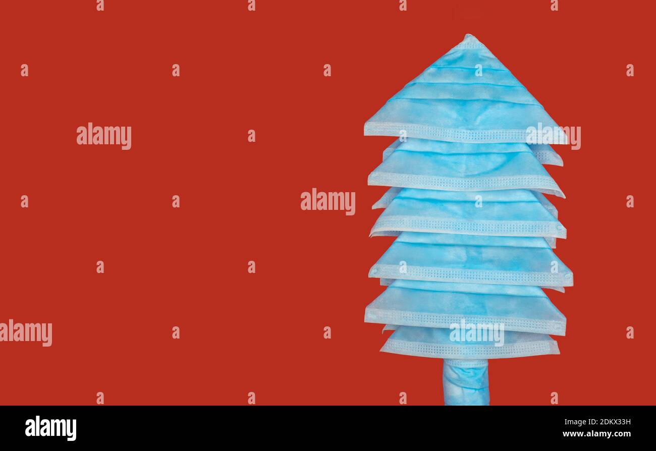 handmade christmas tree made of medical masks. facial bandages are ...