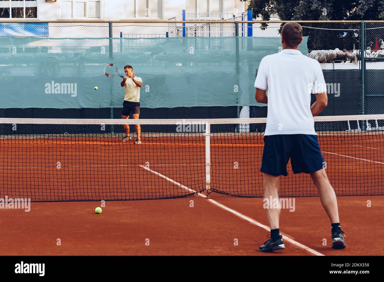 Two men playing tennis hi-res stock photography and images - Alamy