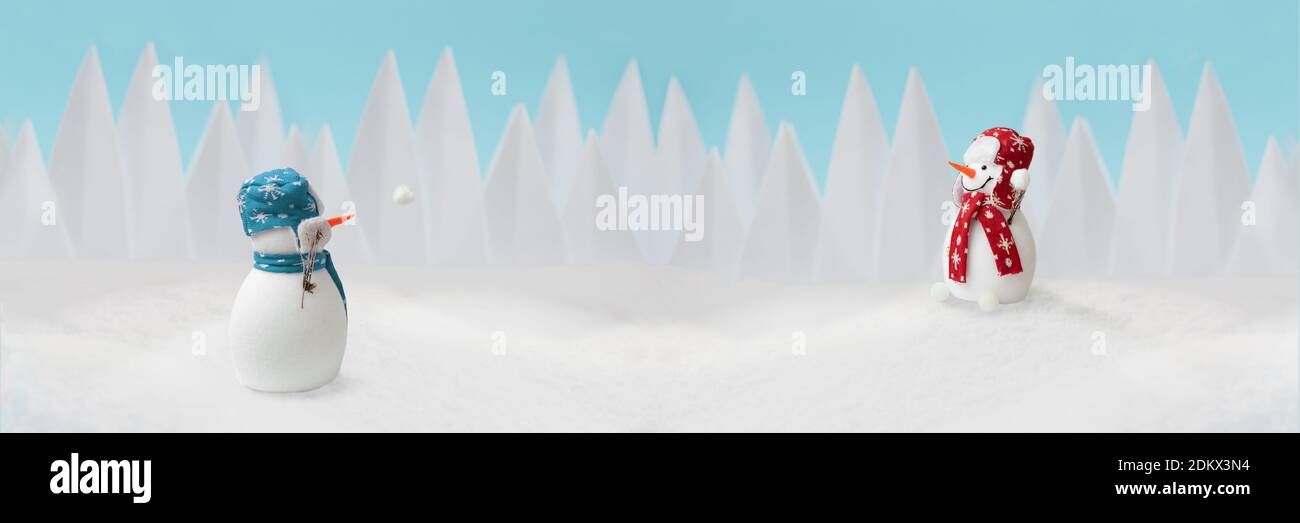 Banner 3:1. Happy snowmen playing snowballs in winter christmas ...