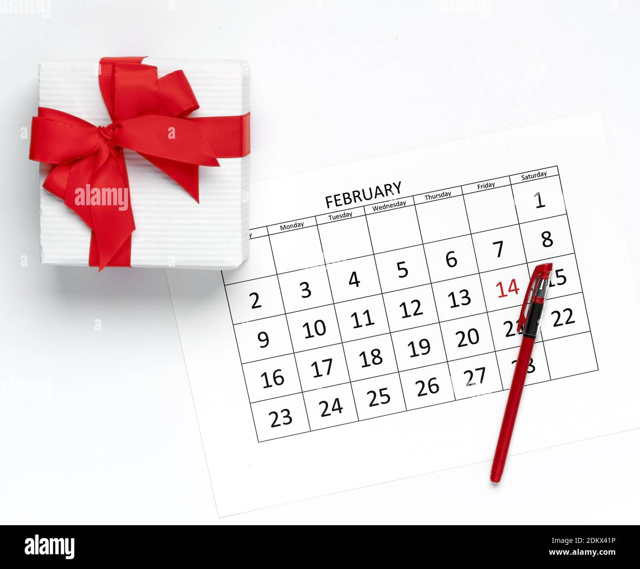 Valentine's day concept. Calendar template with pen and gift box on ...
