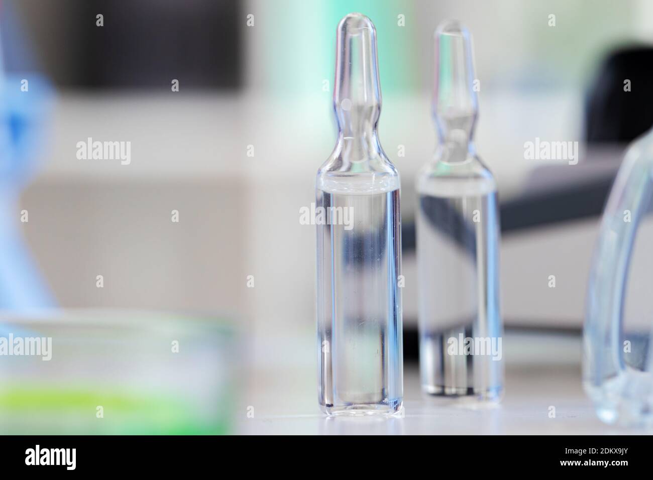 Glass bottle of medication for injections on table Stock Photo - Alamy