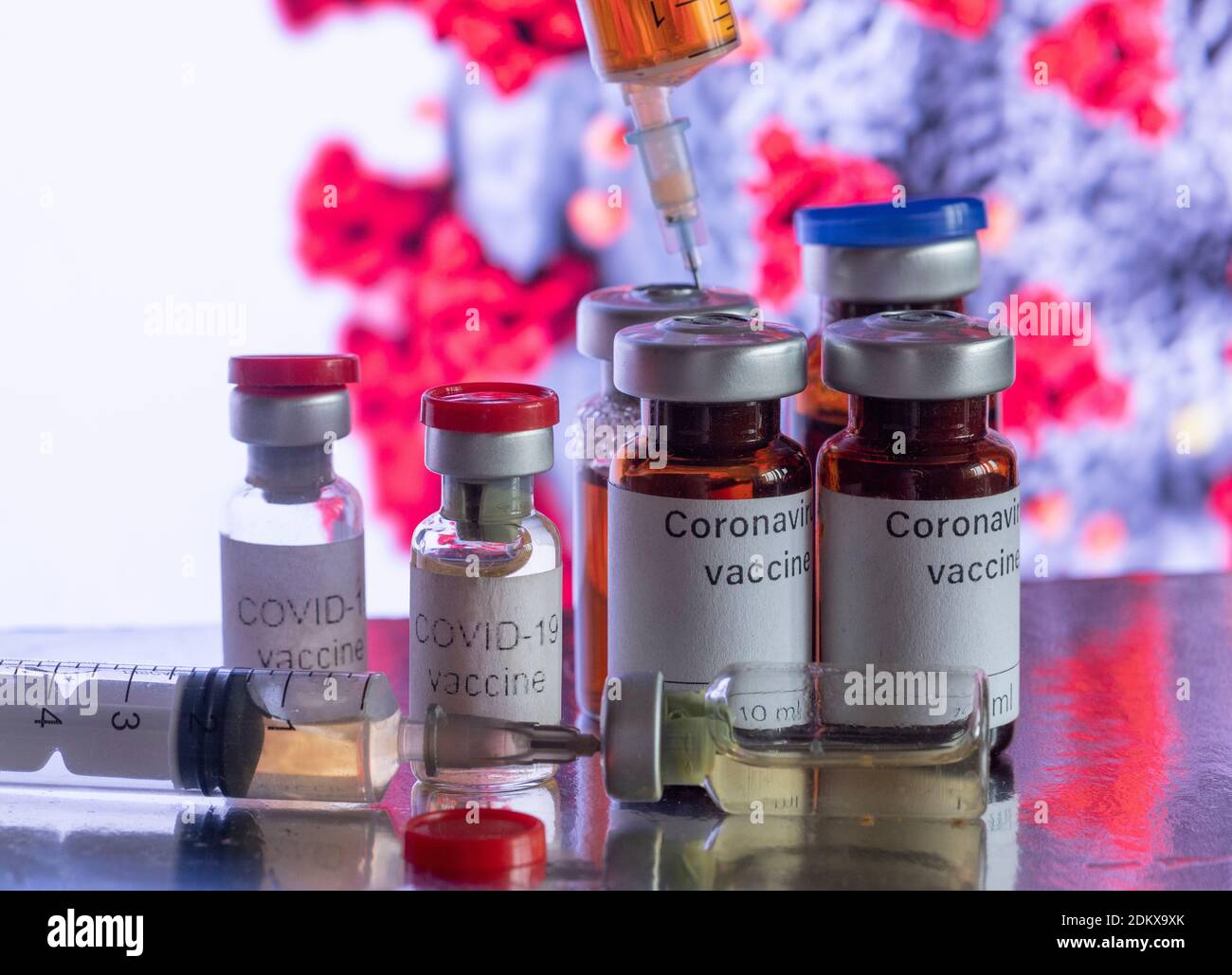 In this photo illustration, vials labelled as Coronavirus vaccine and a ...