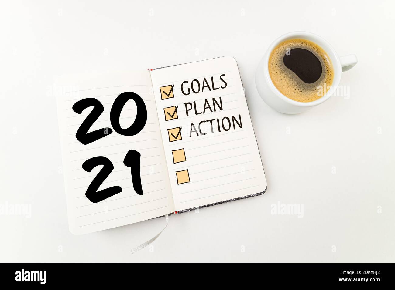 New year goals 2021 on desk. 2021 resolutions list with notebook ...