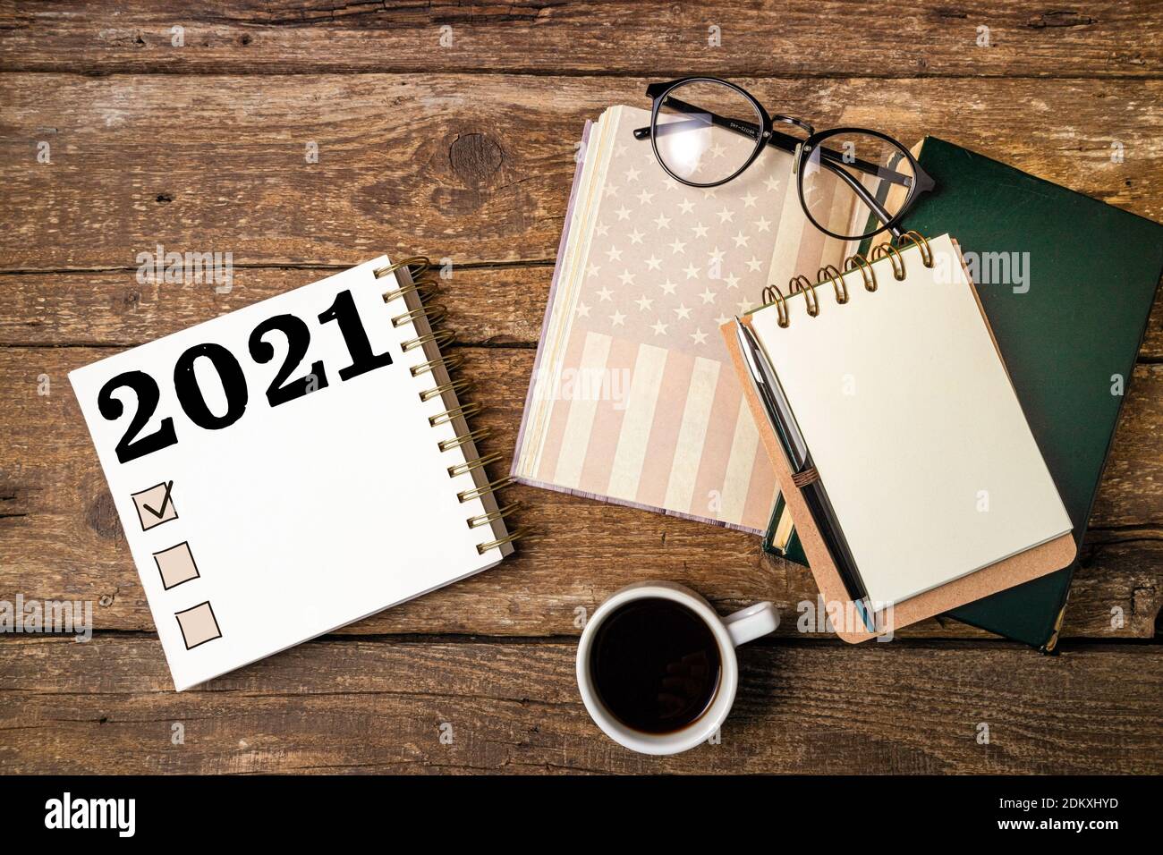 New year resolutions 2021 list. Office desk table with notebooks ...