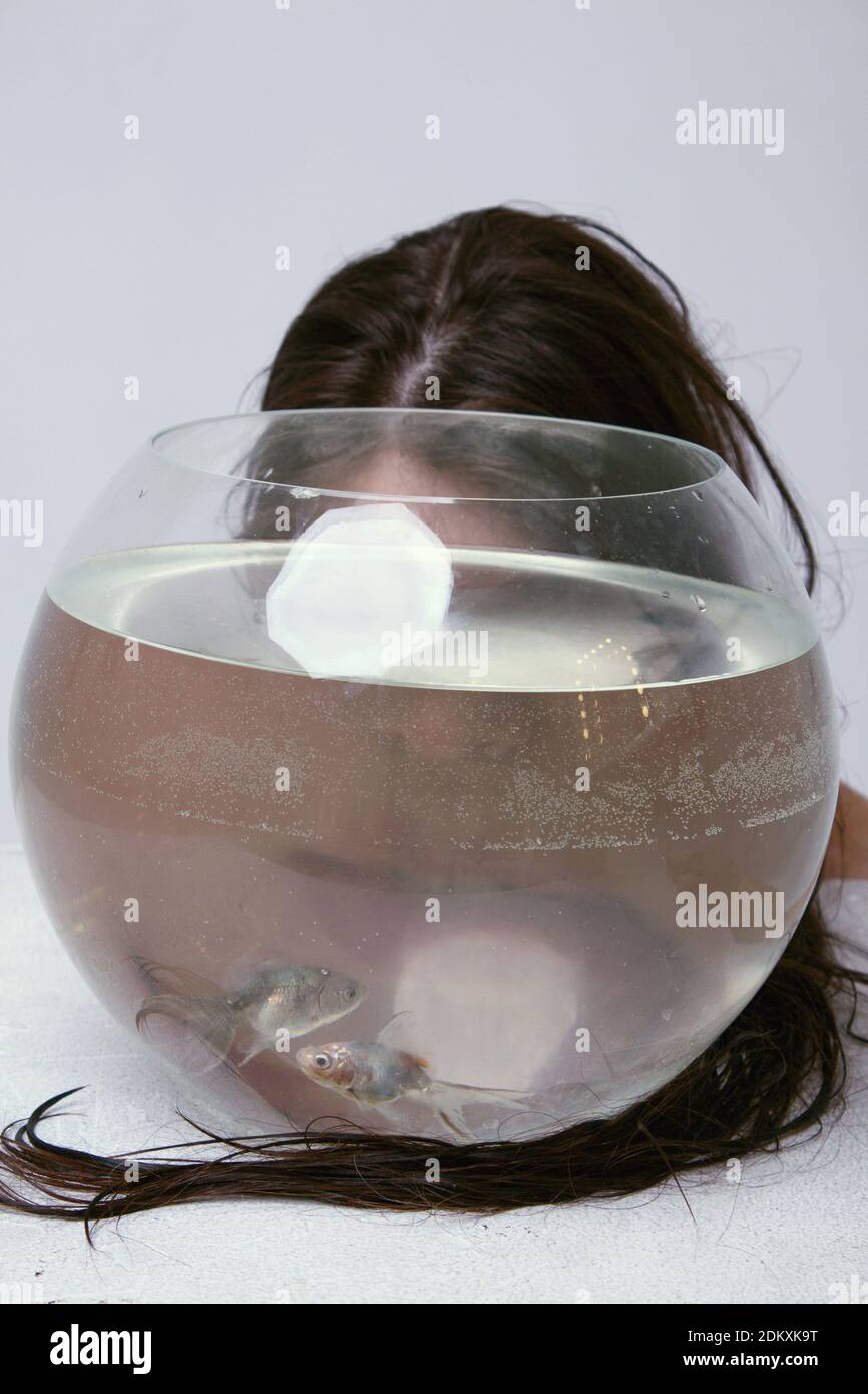 Goldfish bowl woman hi-res stock photography and images - Alamy
